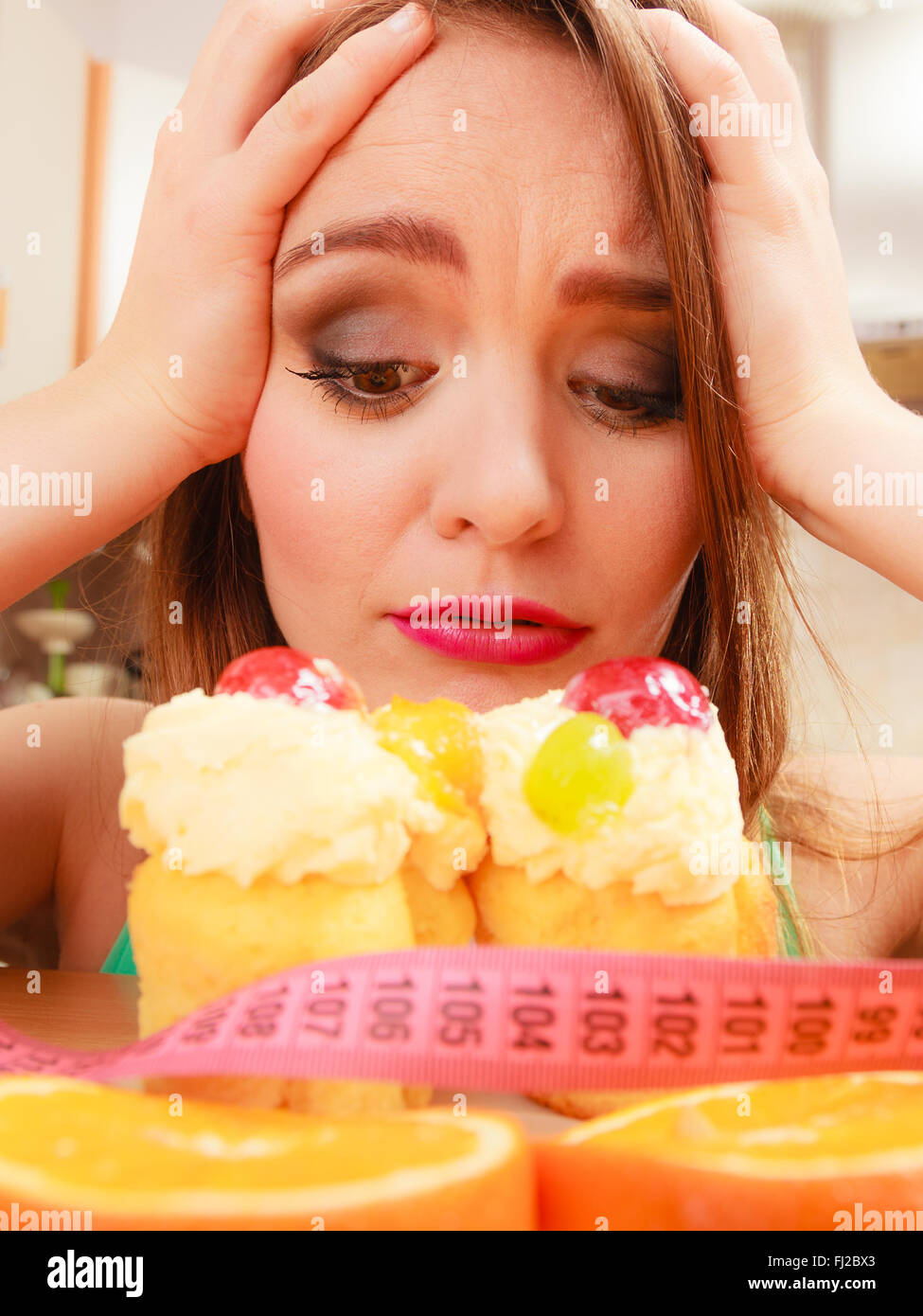 Woman cake resisting hi-res stock photography and images - Alamy