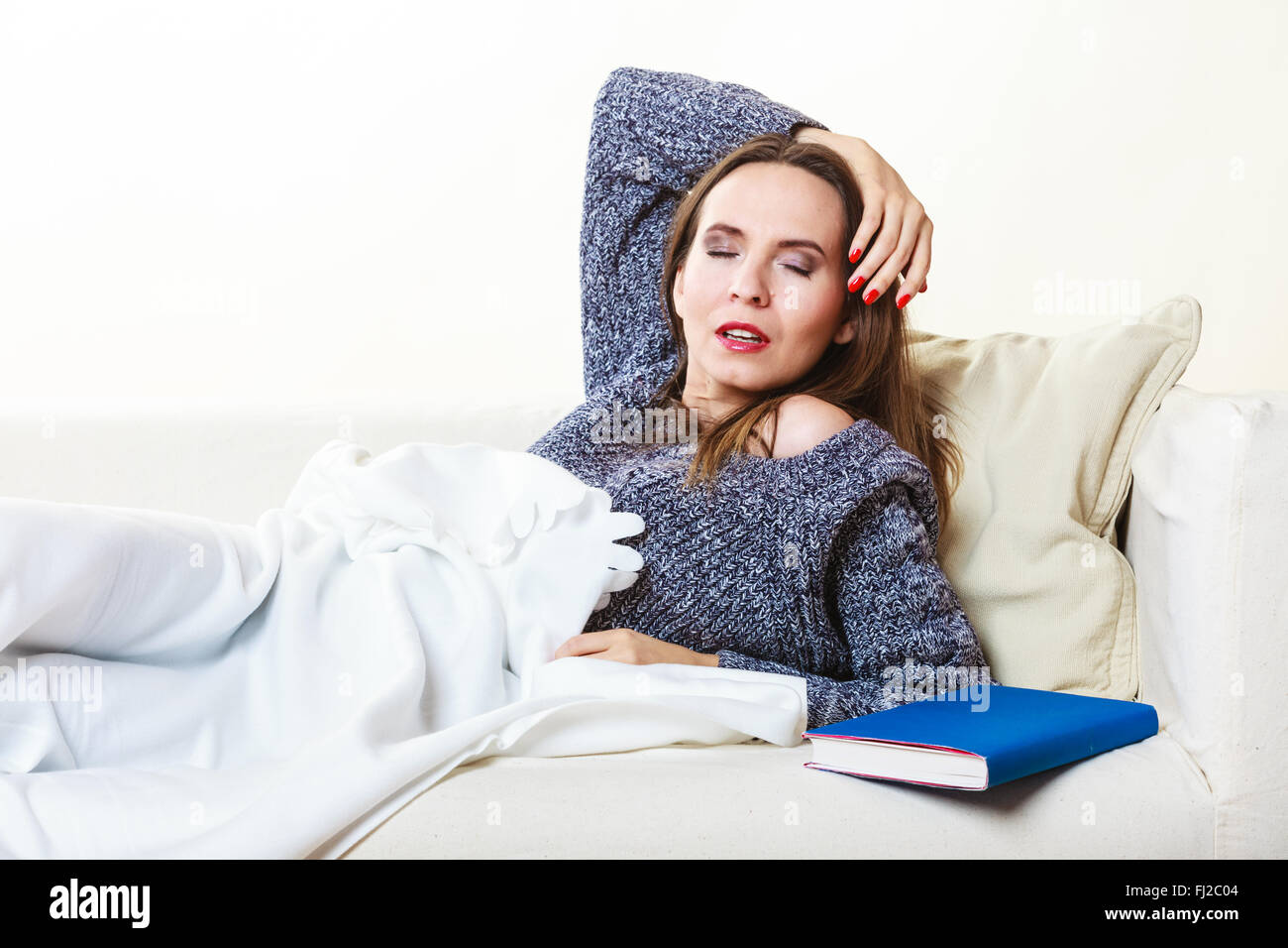 Woman taking an afternoon nap hi-res stock photography and images - Alamy