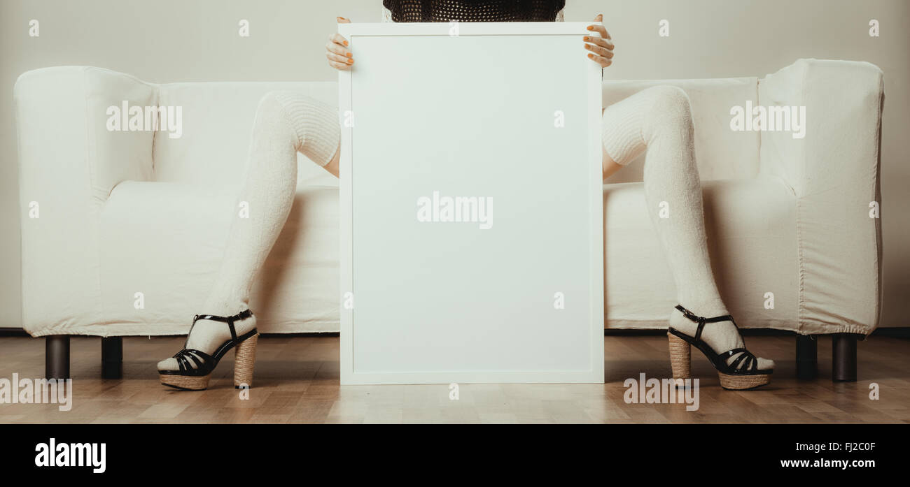 Advertisement concept. woman legs with blank presentation board. Female ...