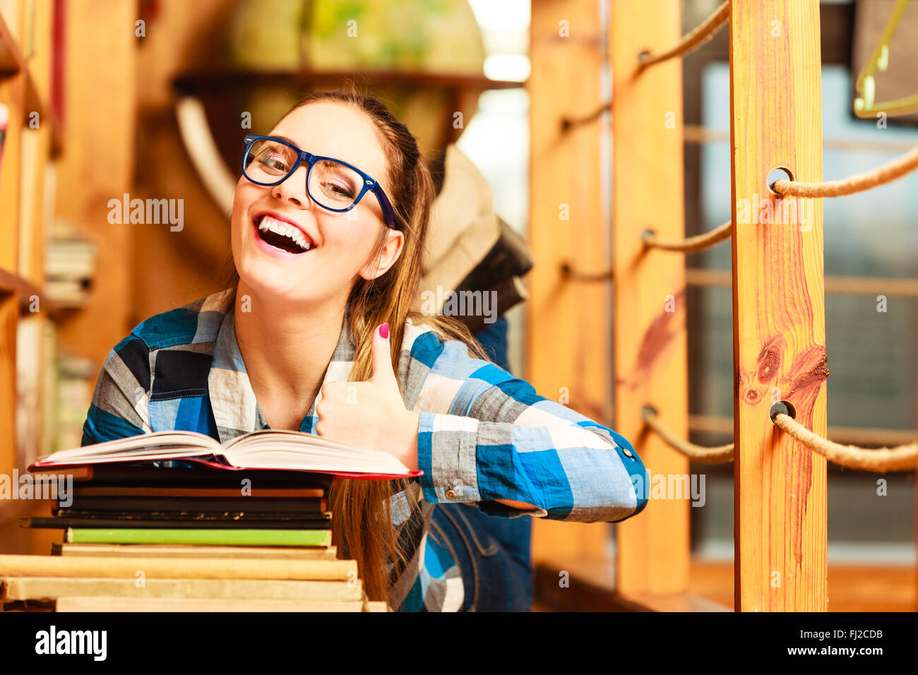 Education school concept. Clever female student girl in blue glasses ...