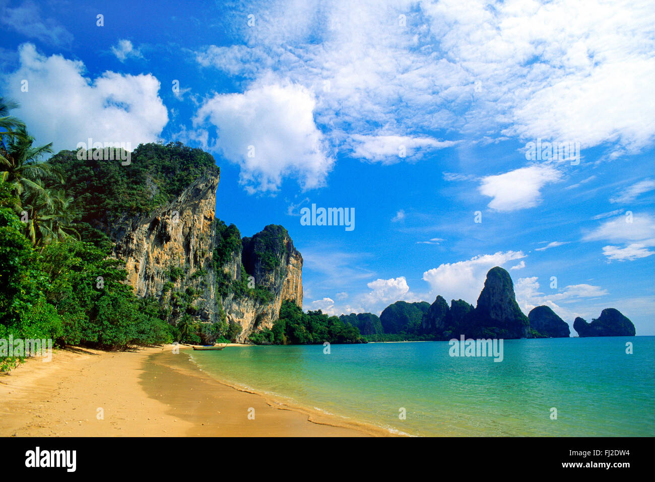 LIMESTONE CLIFFS drop into the clear tropical waters of KRABI BEACH ...