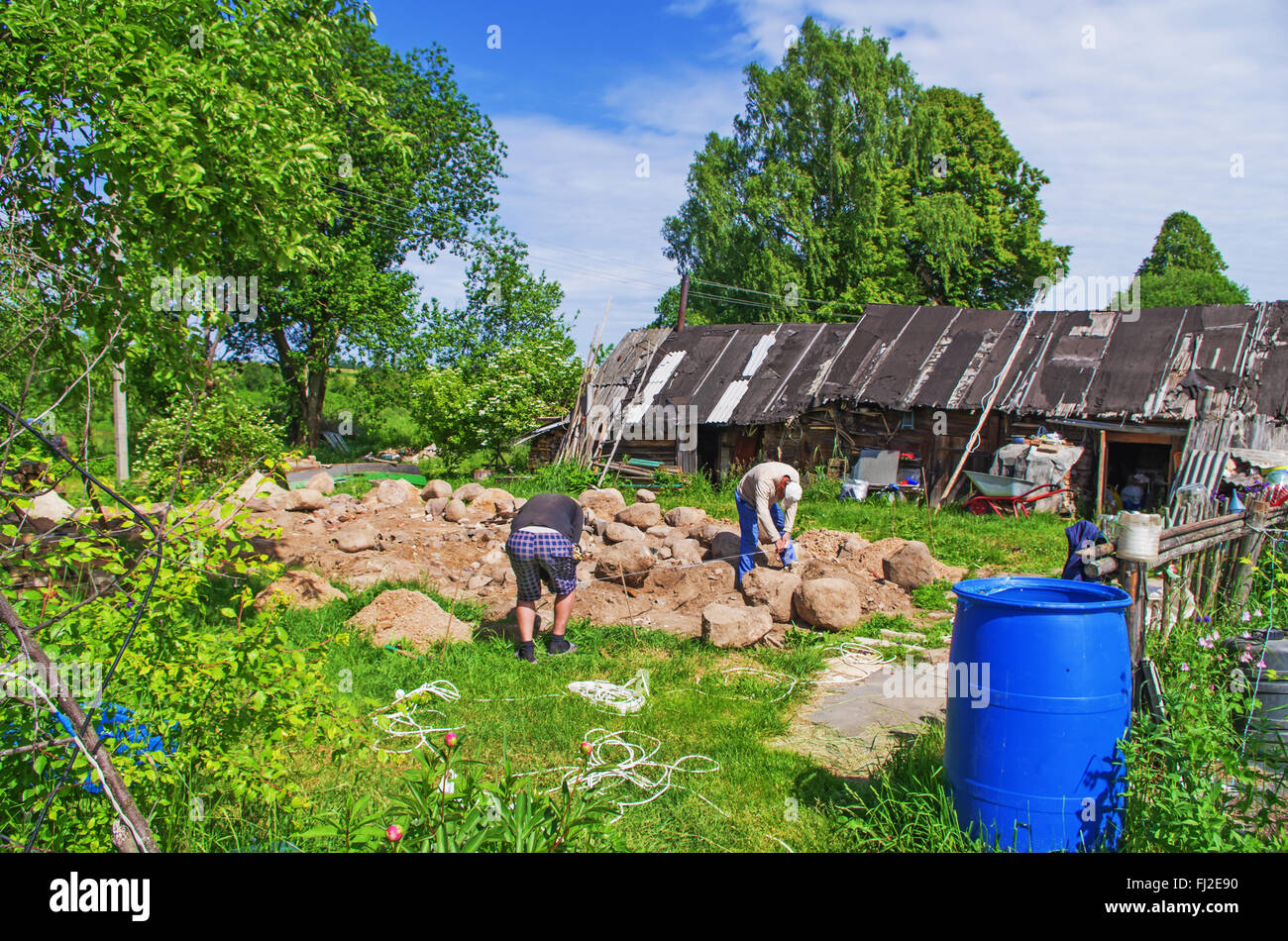 Construction of rural house foundation with use of natural boulders ...