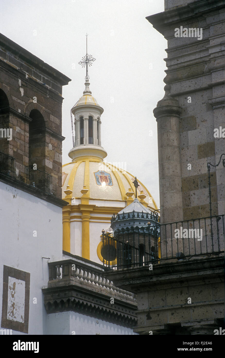 Tiled dome of La Merced church framed by Spanish colonial buildings ...