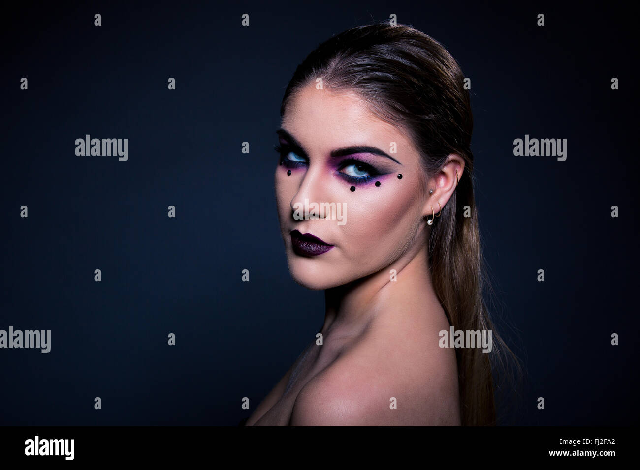 bare shoulders headshot of a beautiful blond woman wearing dramatic ...