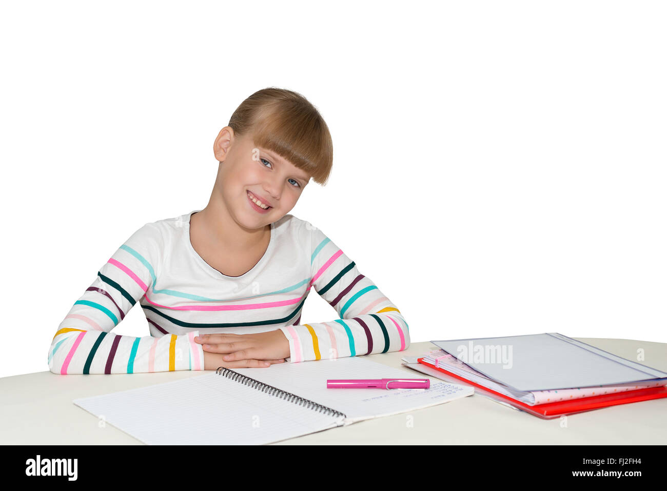 Little cute girl doing homework at the desk isolated Stock Photo - Alamy