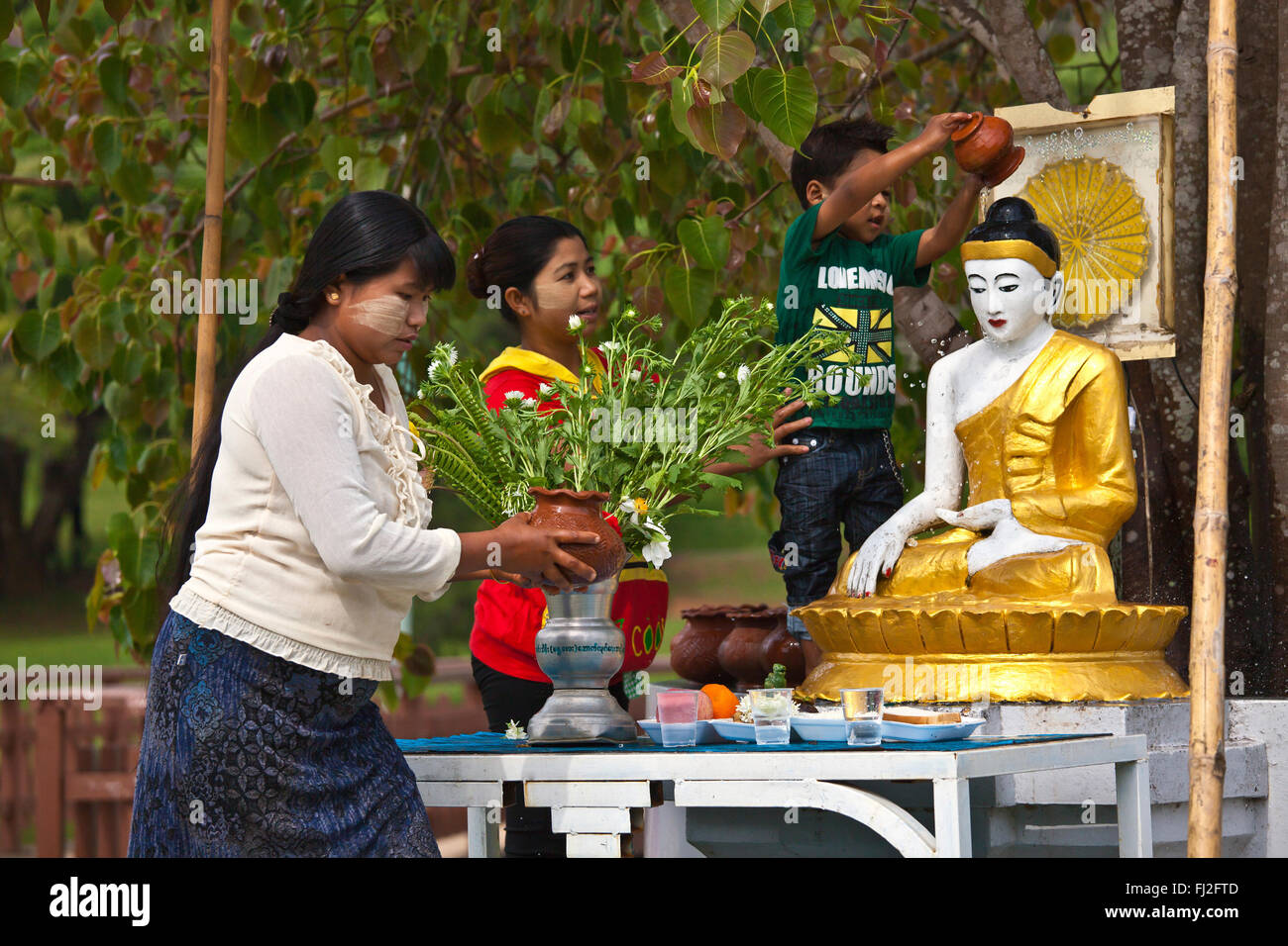BURMESE make offerings to the BUDDHA at the NATIONAL KANDAWGYI GARDENS ...