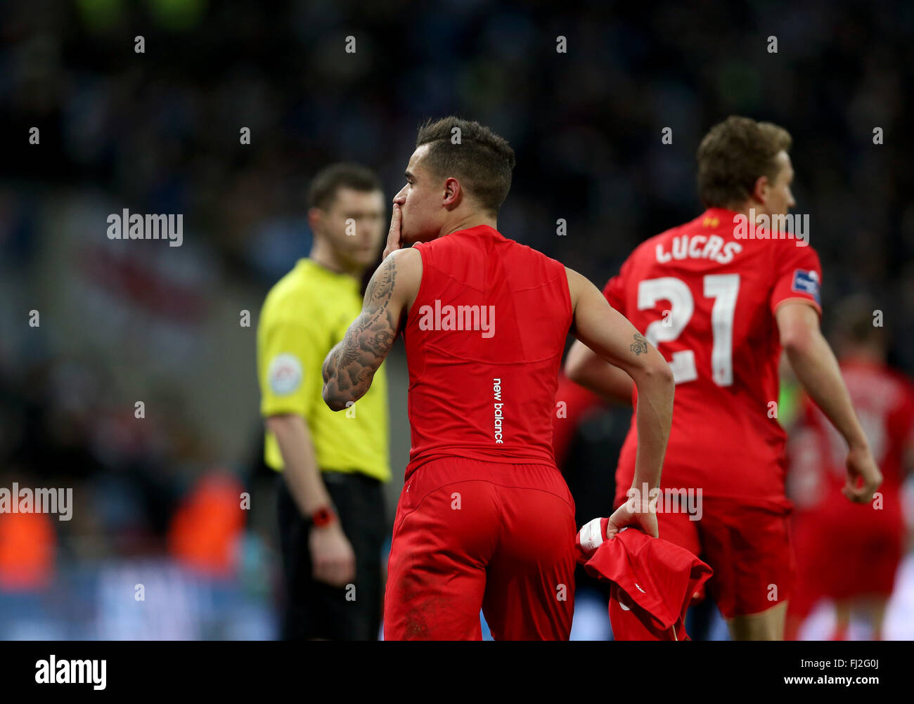 London, L) of Liverpool celebrates after scoring during the Capital One ...
