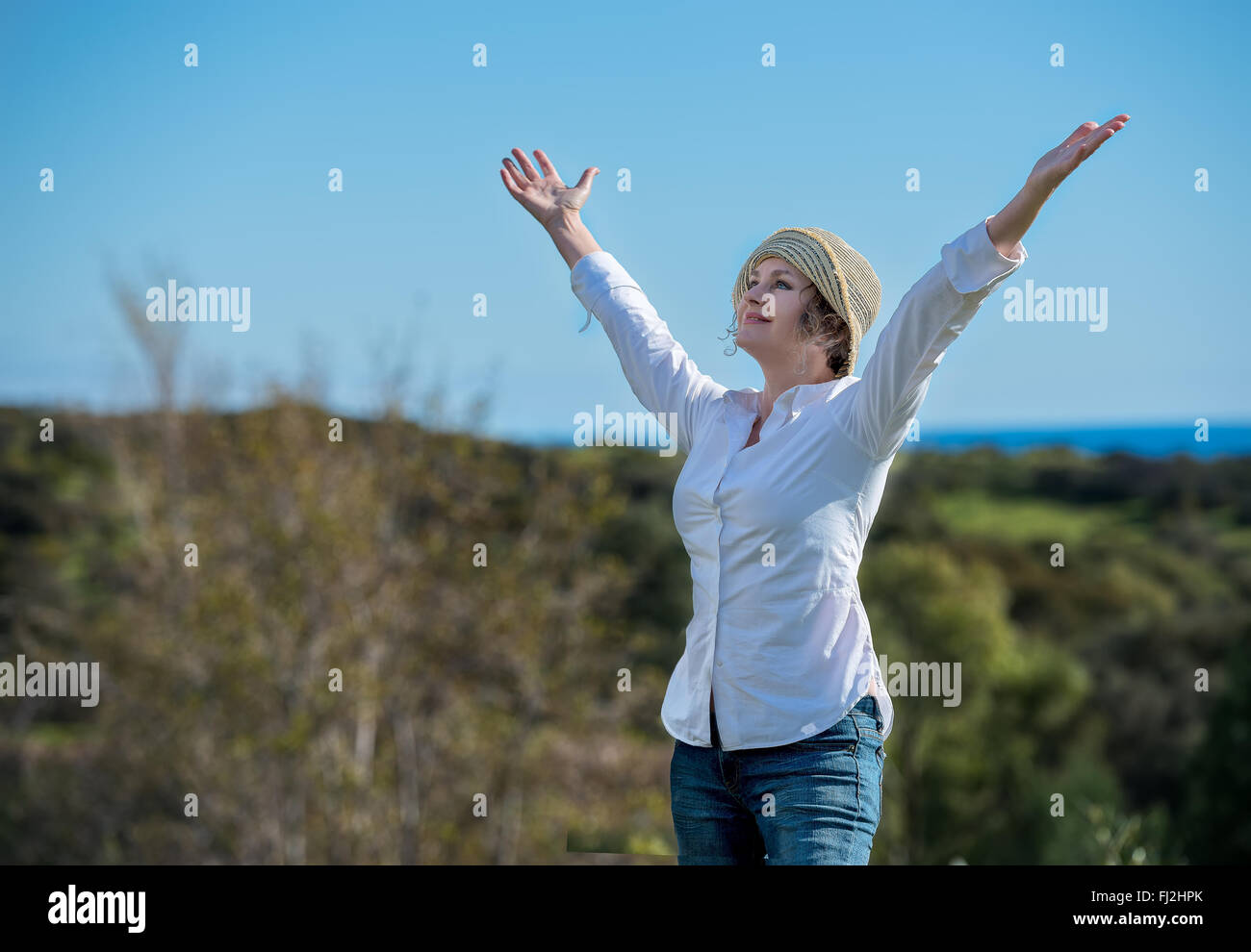 Woman arms outstretched enjoying freedom hi-res stock photography and ...