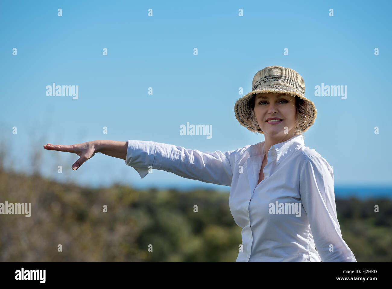 Woman pointing finger in green hi-res stock photography and images - Alamy