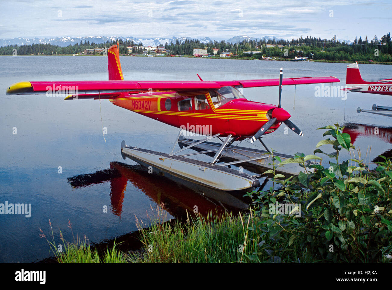 Bush plane parked on the still waters homer hi-res stock photography ...