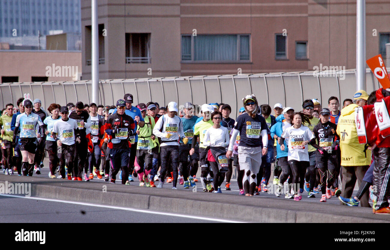 Tokyo, Japan. 28th Feb, 2016. Tokyo Marathon runners run over an ...