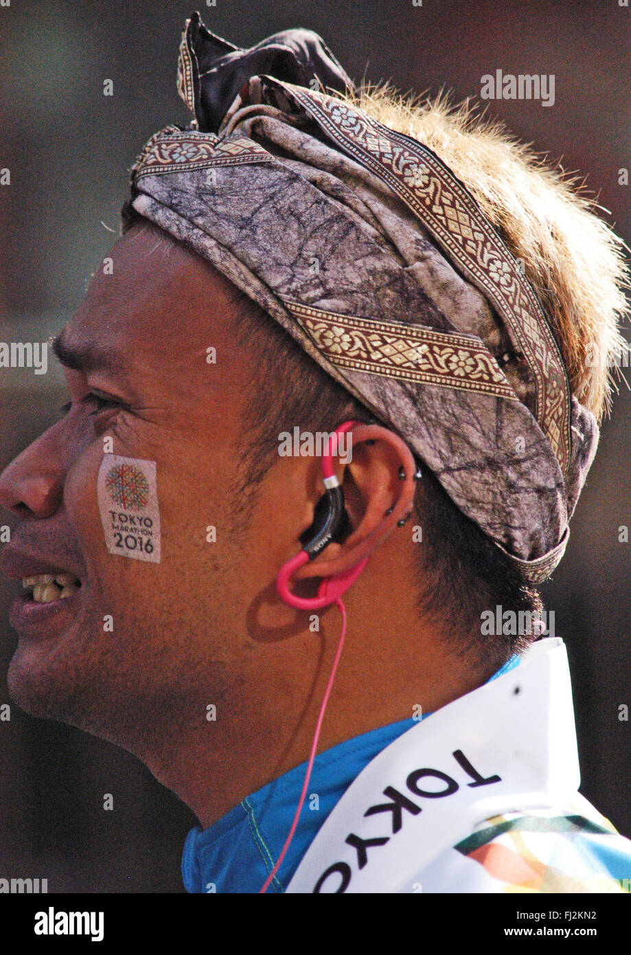 Tokyo, Japan. 28th Feb, 2016. A runner wears a Marathon's logo on his ...
