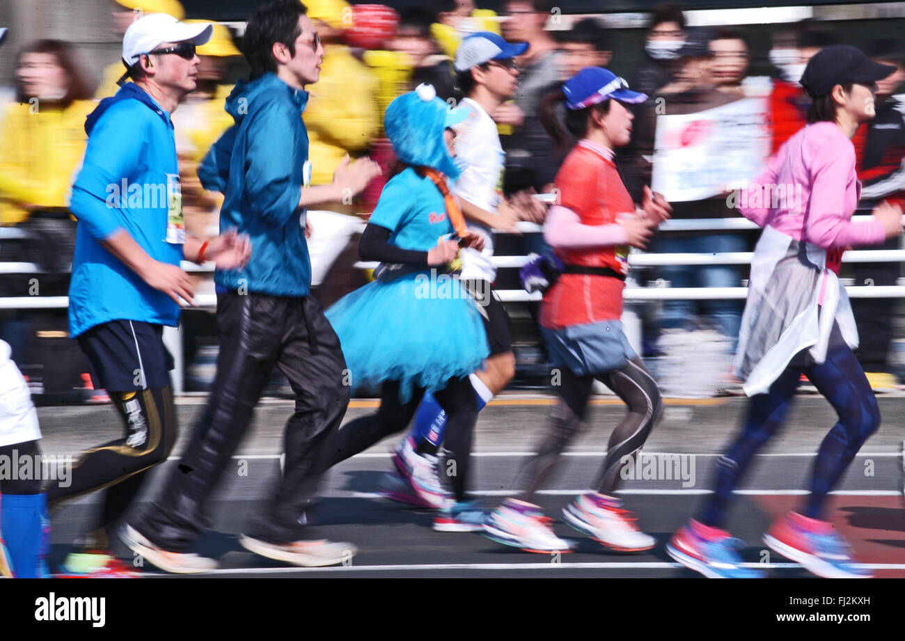 Tokyo, Japan. 28th Feb, 2016. Tokyo Marathon runners pass over a bridge ...