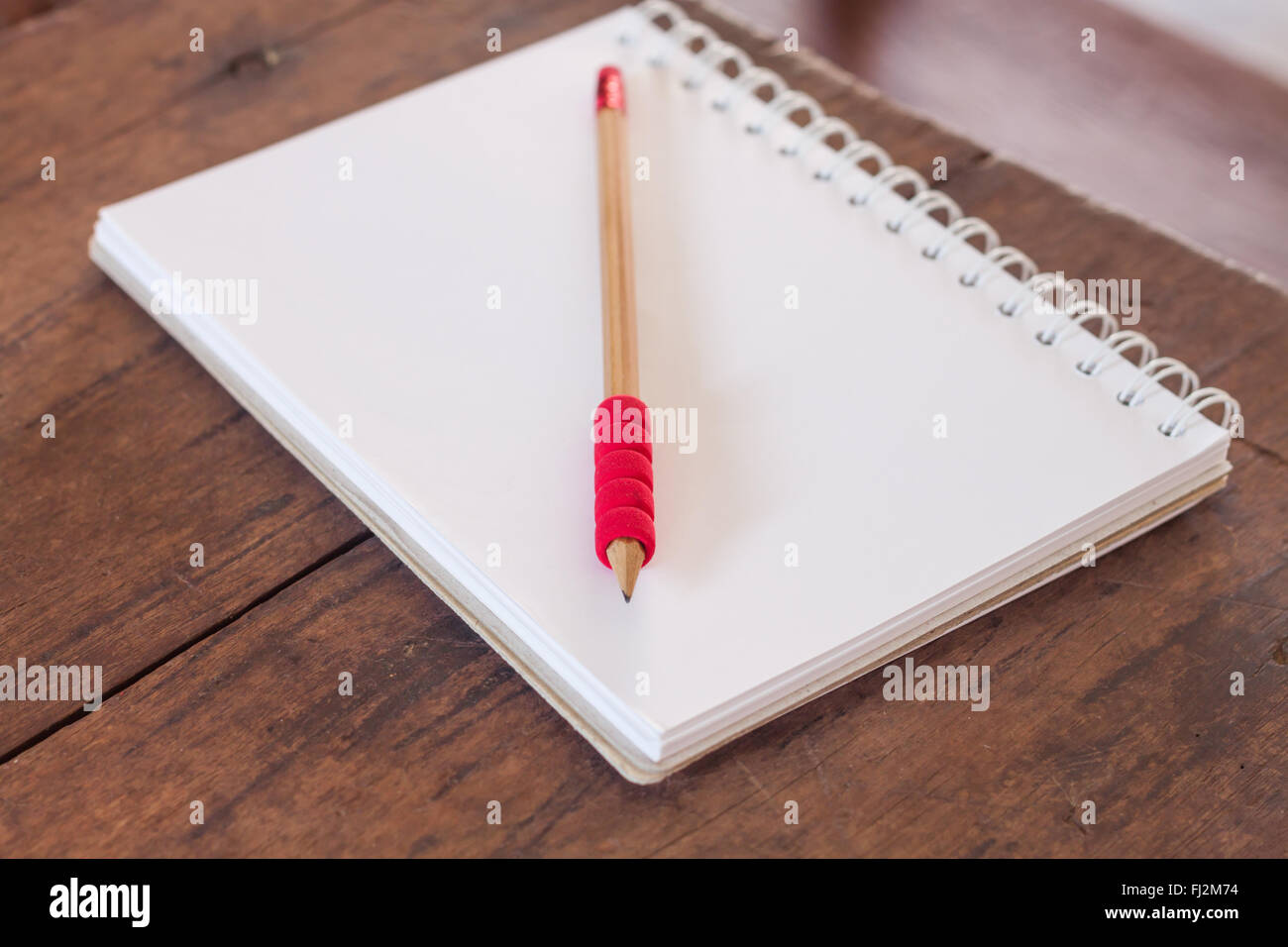 Work station with notebook and pencil, stock photo Stock Photo - Alamy