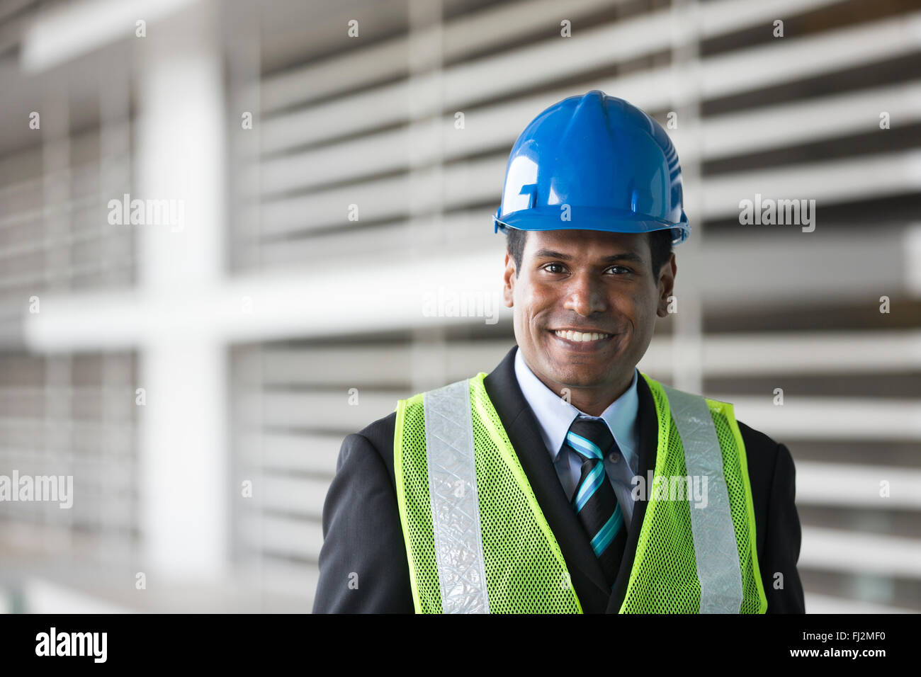 Portrait of a male Indian, industrial engineer at work. Asian engineer ...
