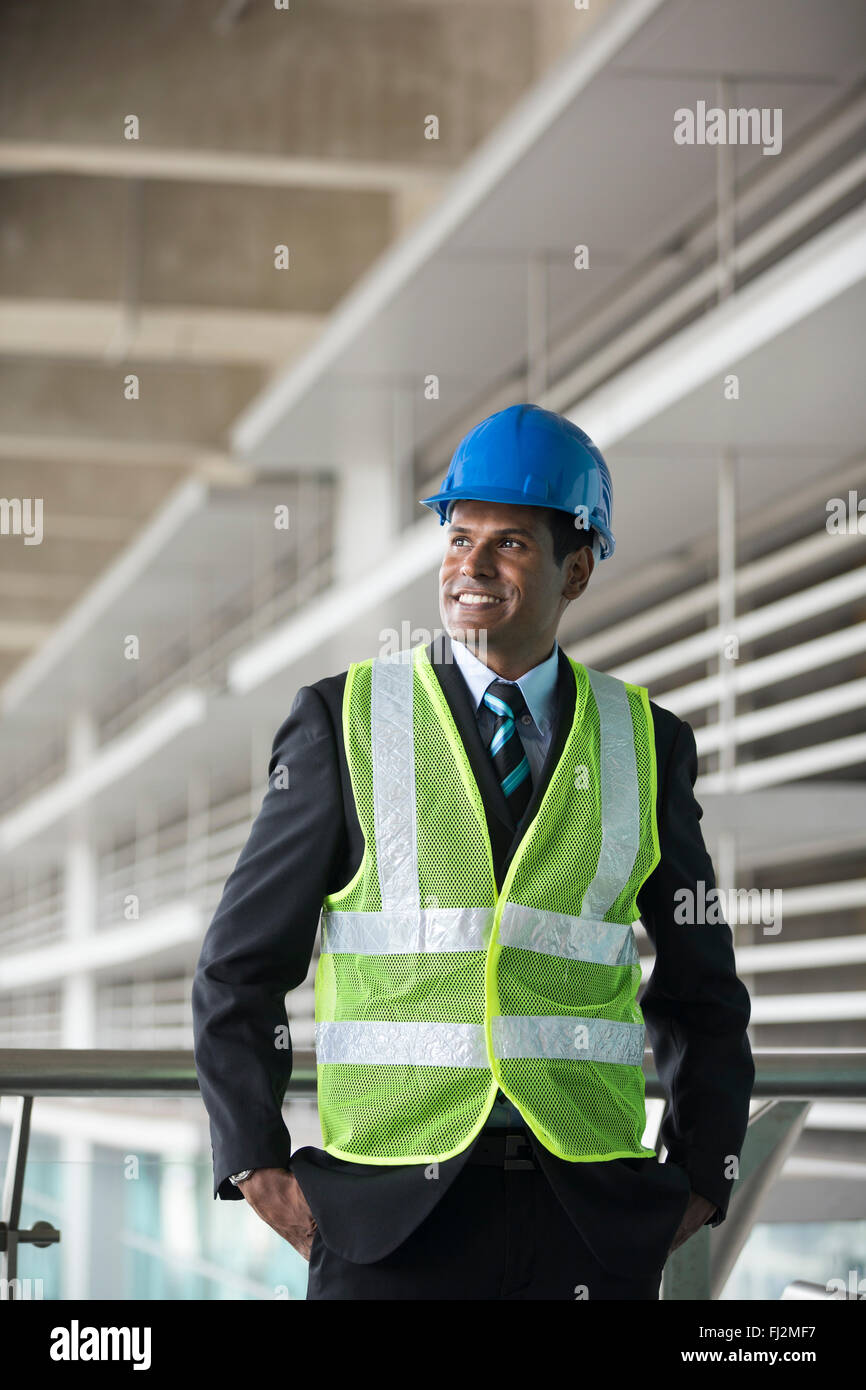 Portrait of a male Indian, industrial engineer at work. Asian engineer ...