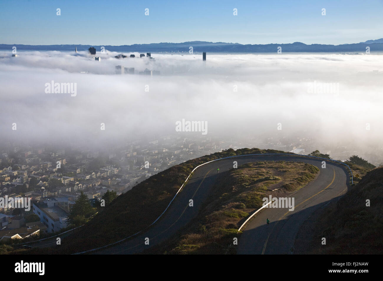 Skyscrapers peak through the fog over the San Francisco Bay as seen ...