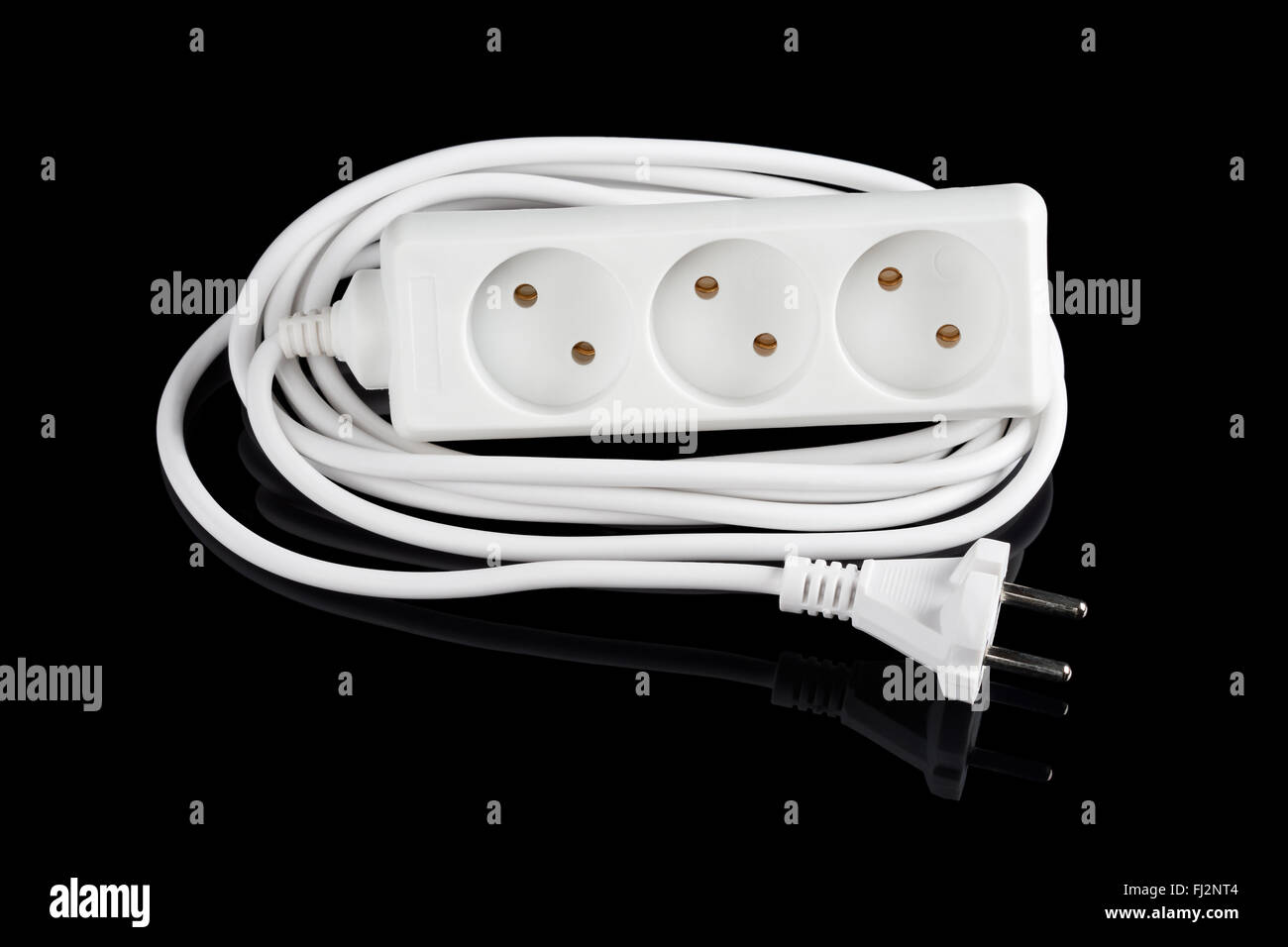 White plastic electrical outlet extension isolated on black reflecting ...