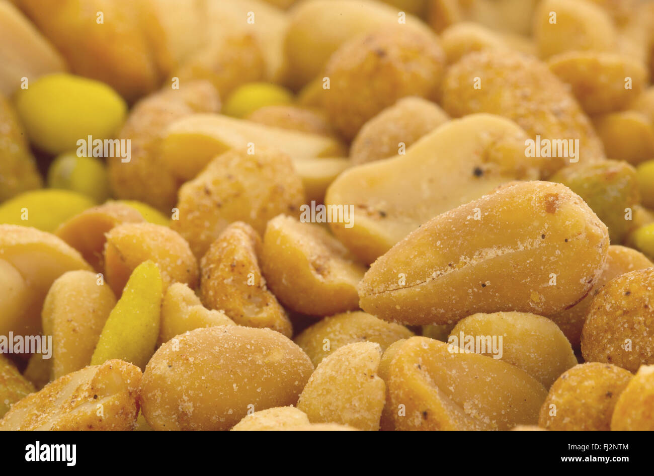 Fresh mixed salted nuts for backgrounds, peanut mix Stock Photo - Alamy