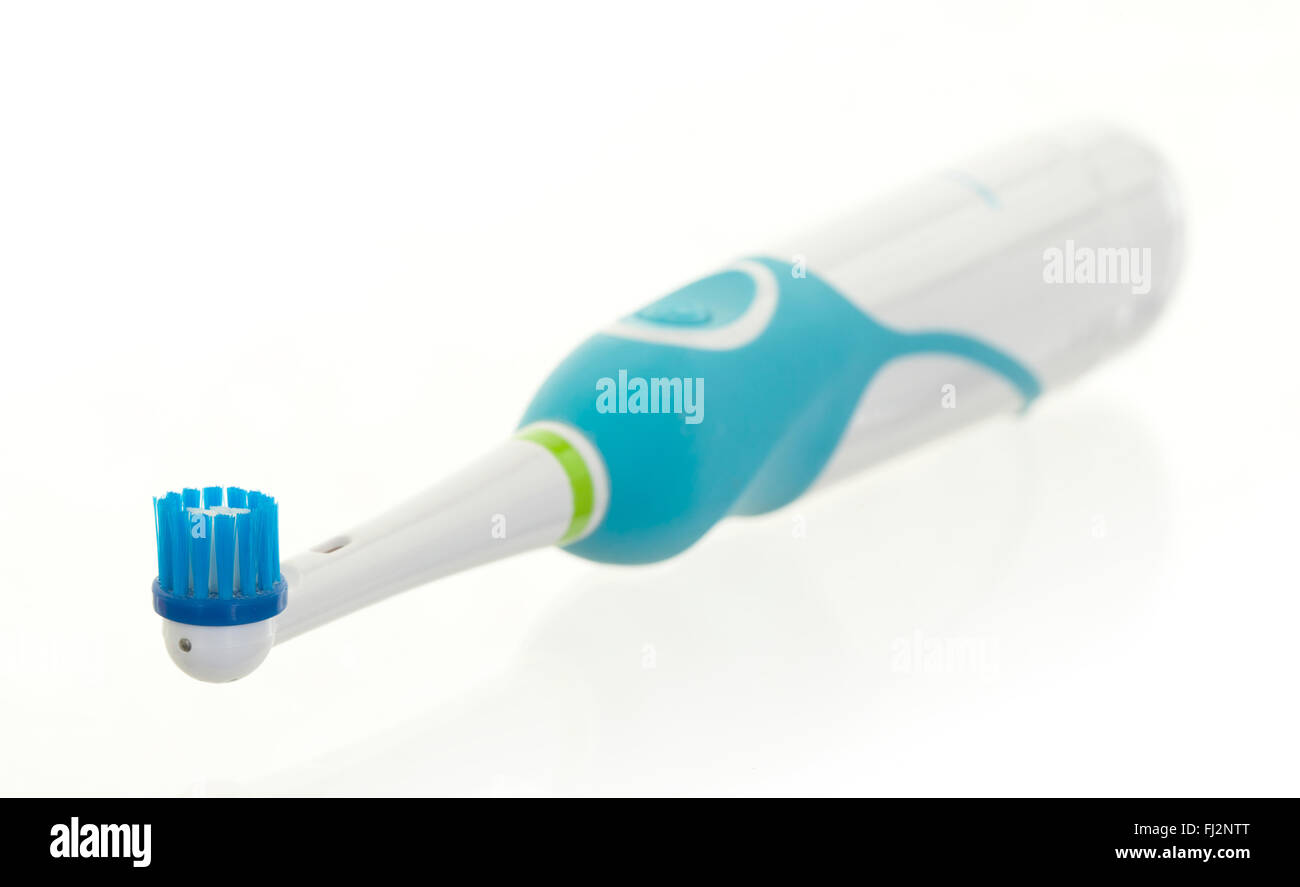 Electric toothbrush isolated on a white background Stock Photo - Alamy