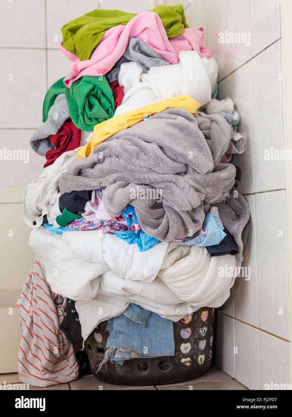 Overflowing Laundry Basket High Resolution Stock Photography and Images ...