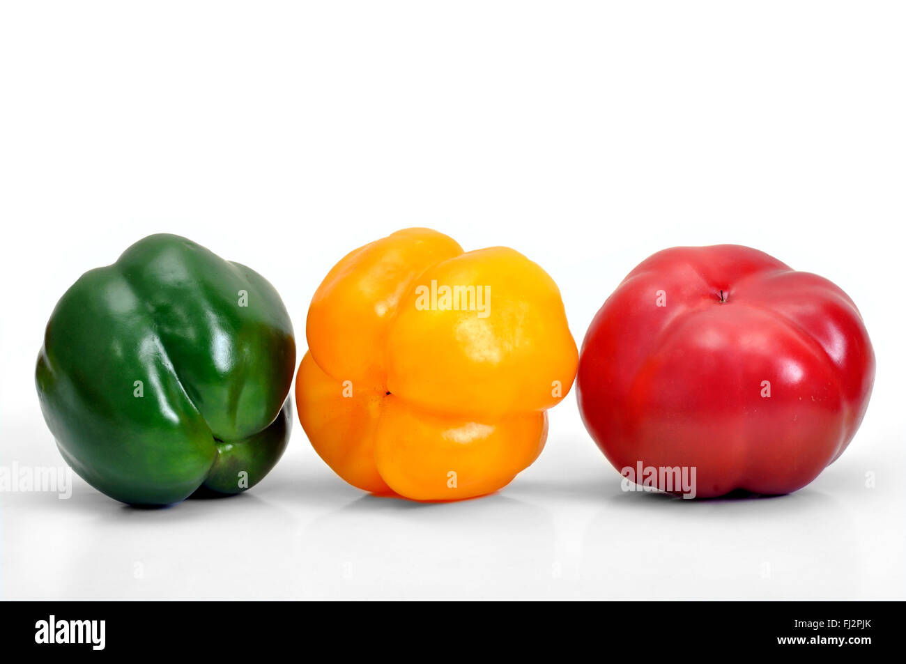assorted fresh multicolored peppers on white background Stock Photo - Alamy