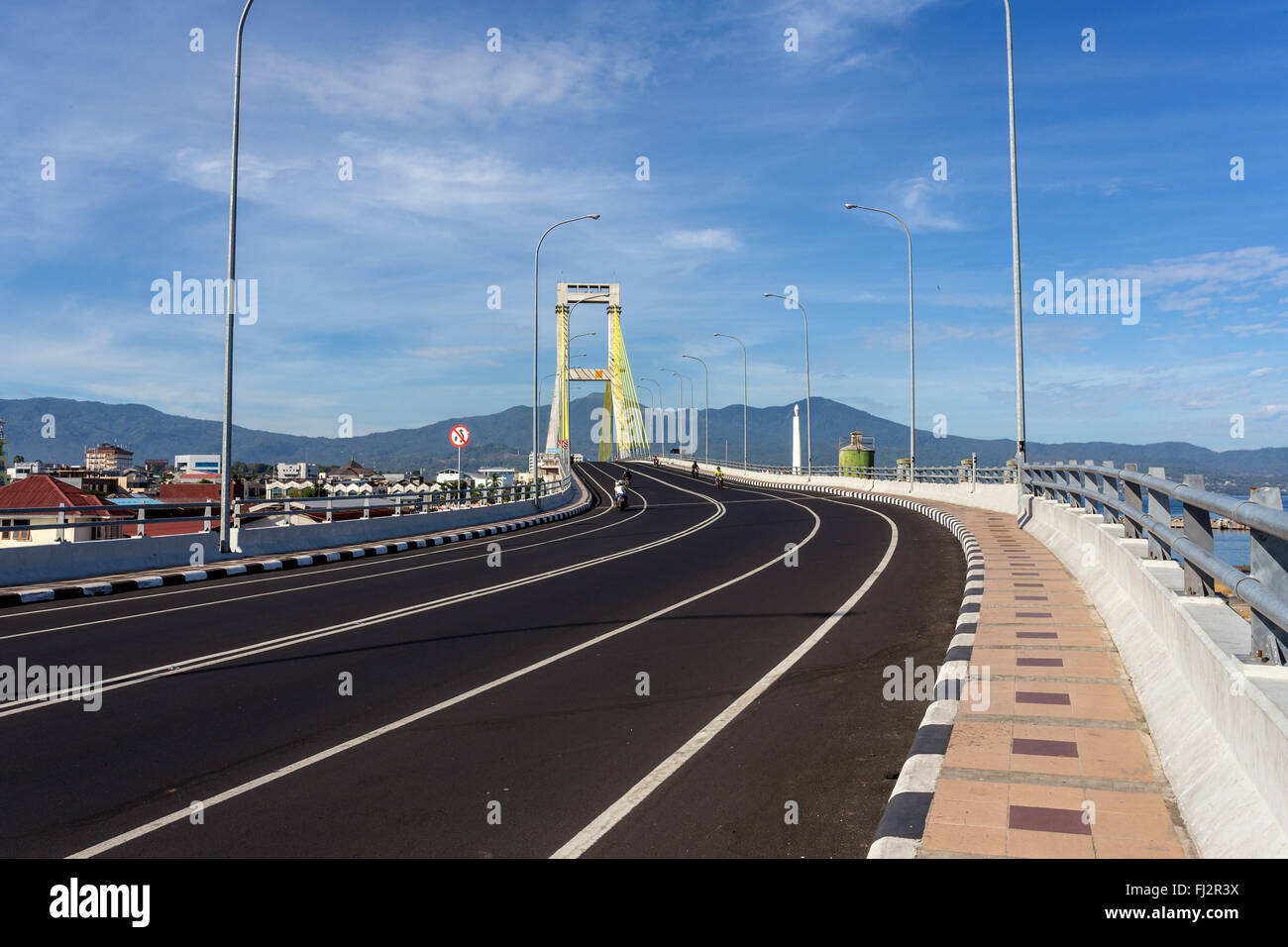 The Sukarno Bridge over the harbor in Manado, North Sulawesi, Indonesia ...
