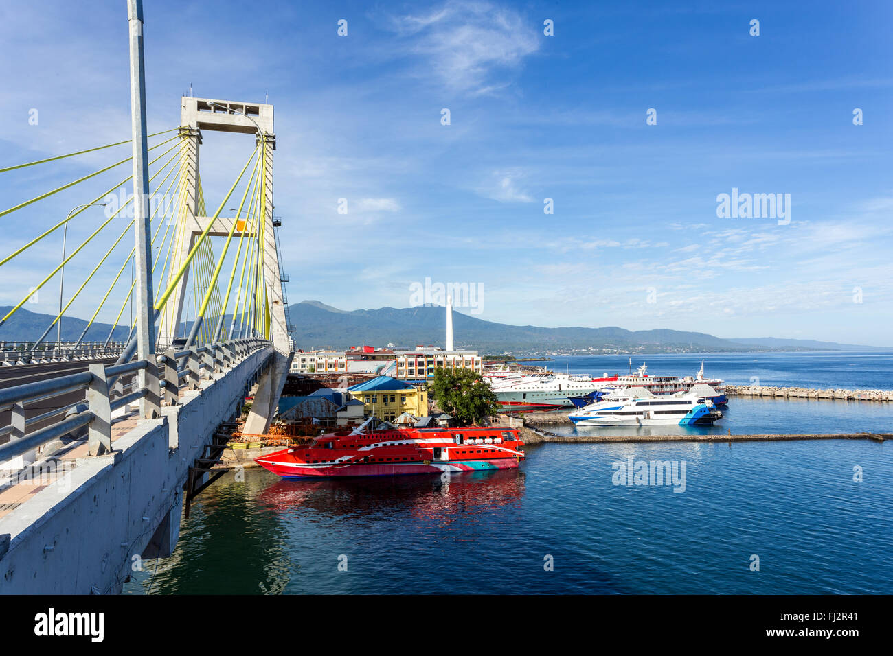 view of indian ocean harbor in Kota Manado City, Indonesia with blue ...