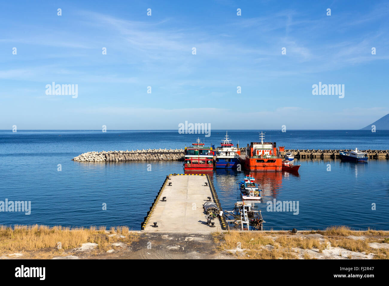 view of indian ocean harbor in Kota Manado City, Indonesia with blue ...