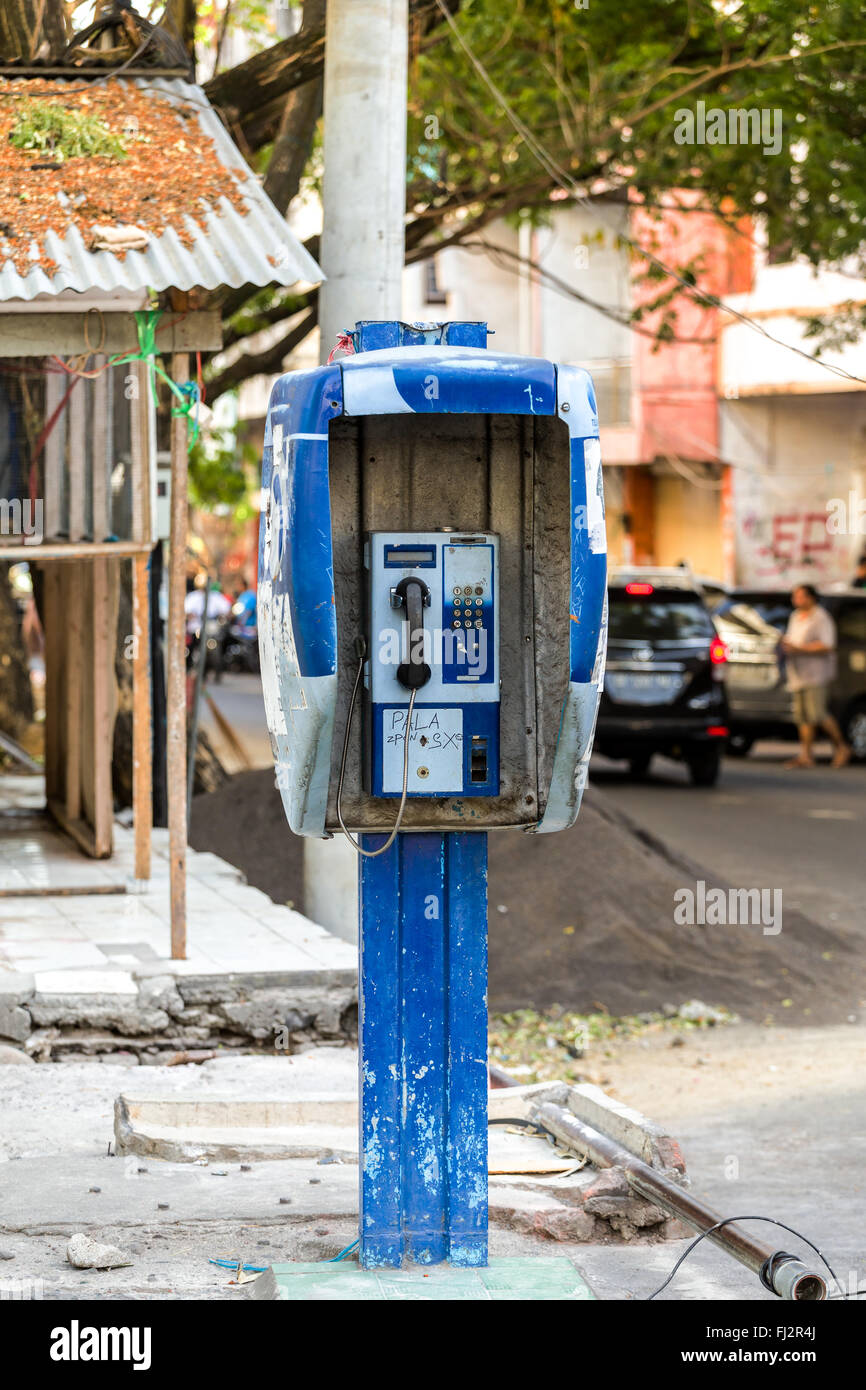 Old, dirty and damaged phone booth in Kota manado City, North Sulawesi ...