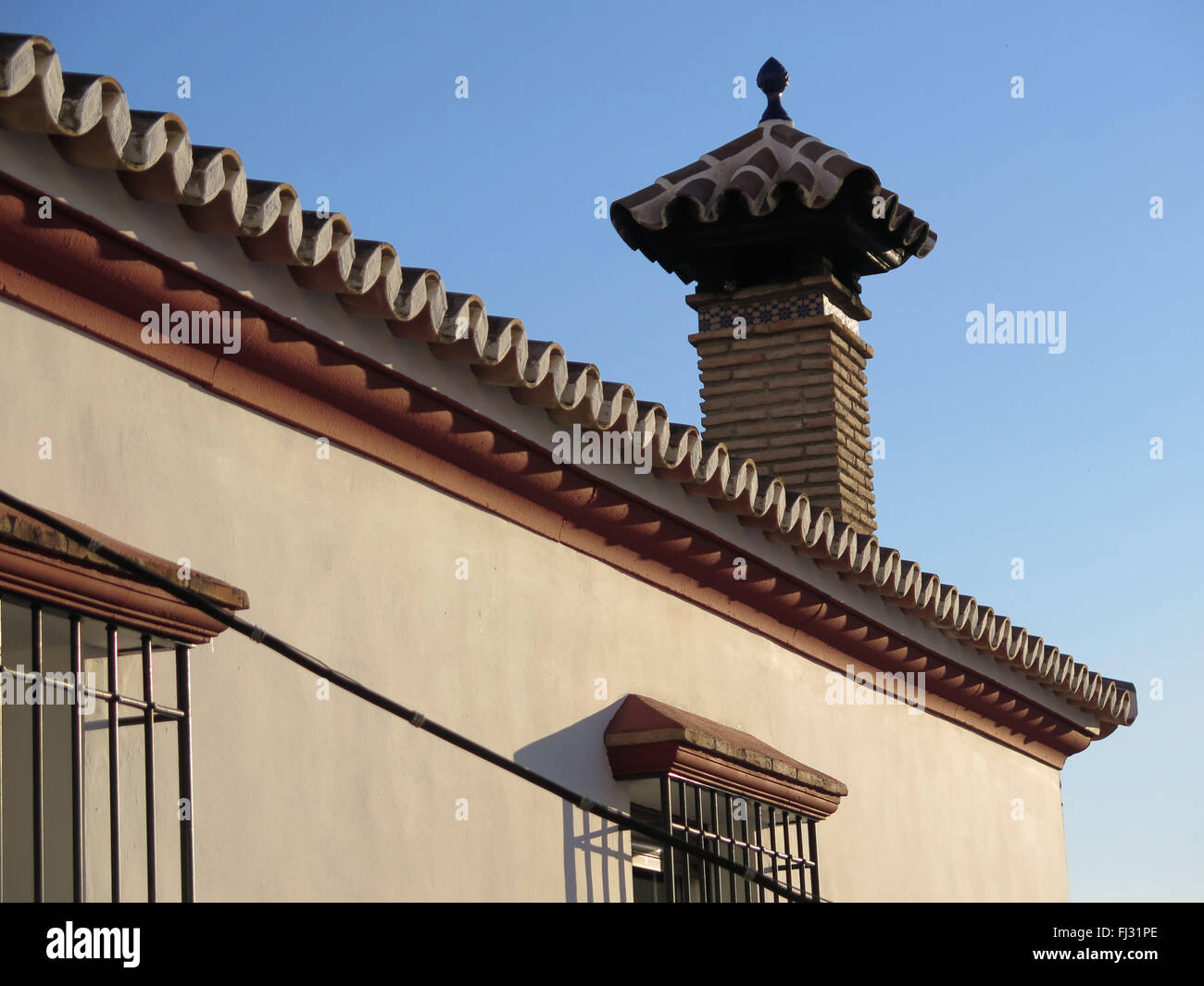 Chimney stack on roof of apartment building in Alora Andalucia Stock ...