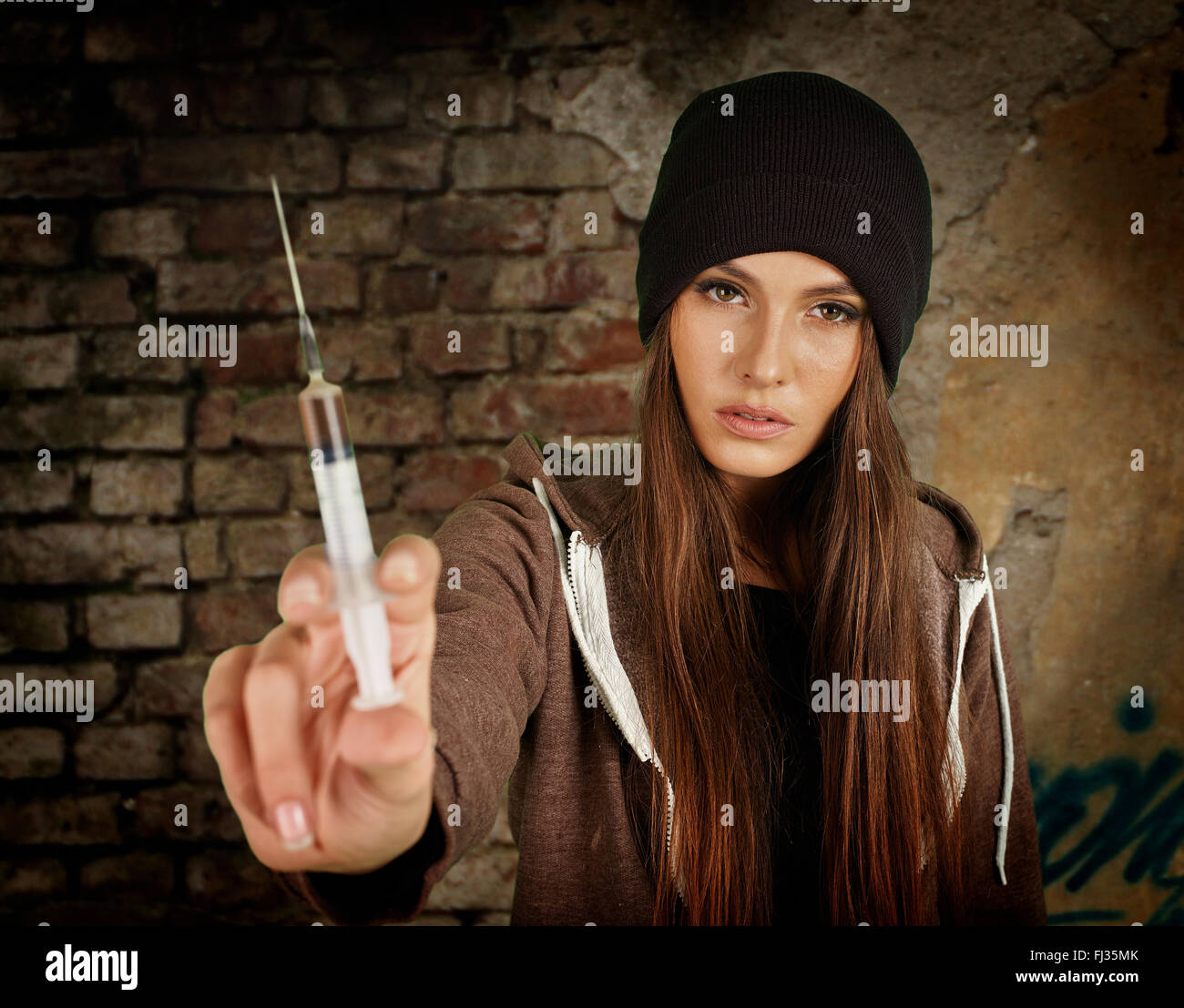 Portrait of woman addicted to syringe Stock Photo - Alamy