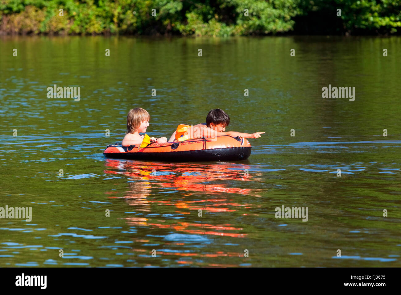 Two boys on boat hi-res stock photography and images - Alamy