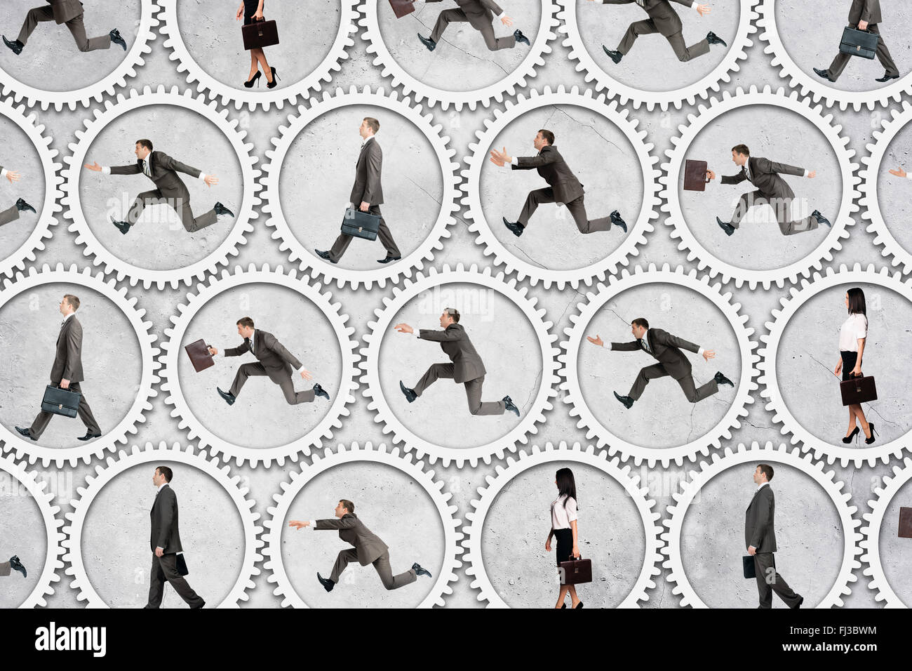 Businessmen running inside gears Stock Photo - Alamy
