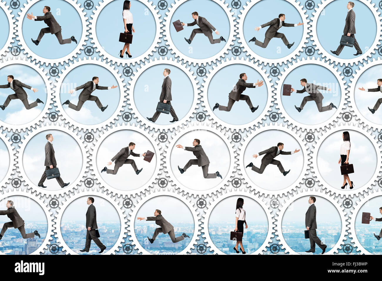 Businessmen running inside gears Stock Photo - Alamy
