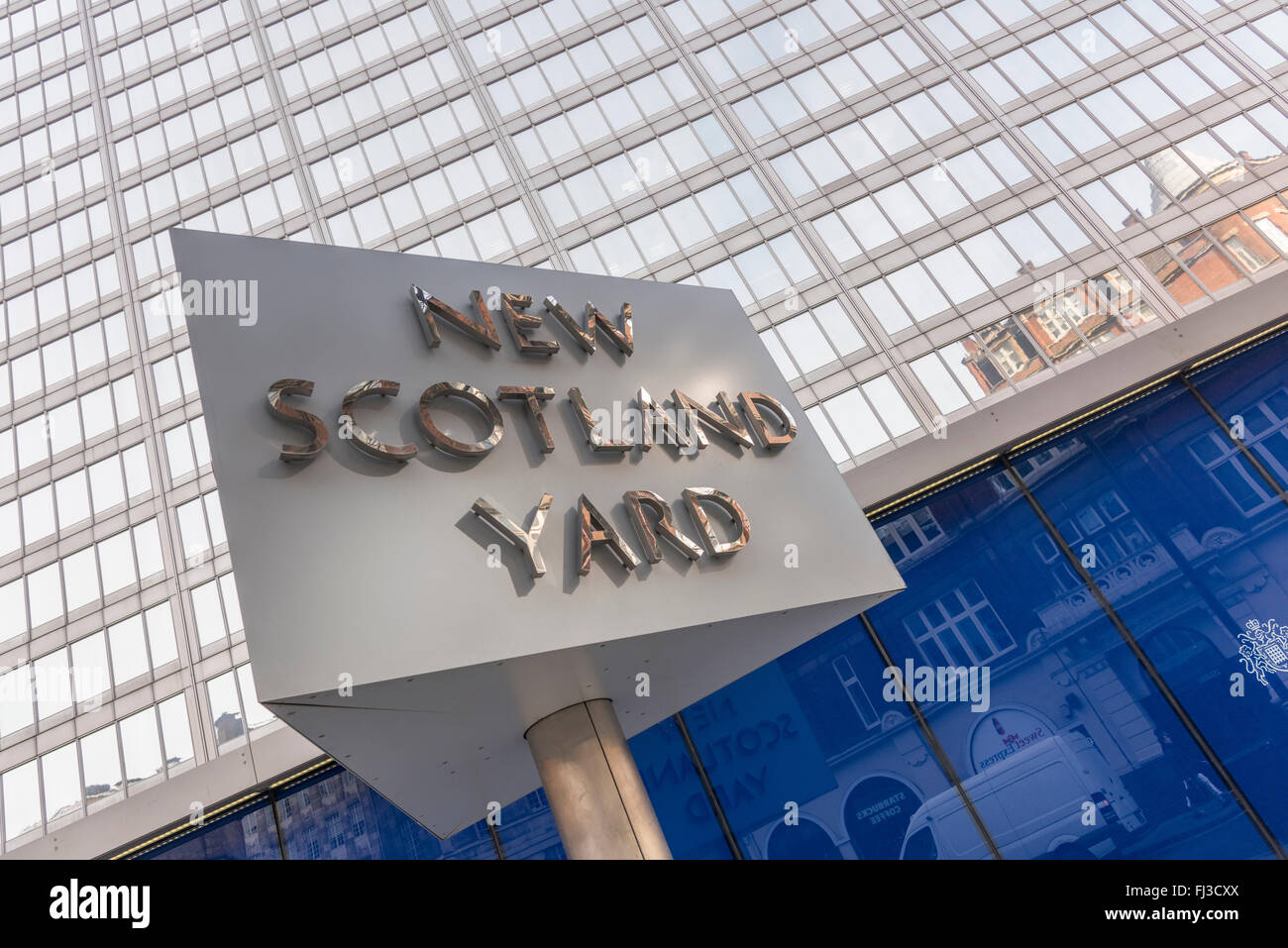 This triangular, revolving, sign stands outside New Scotland Yard which ...