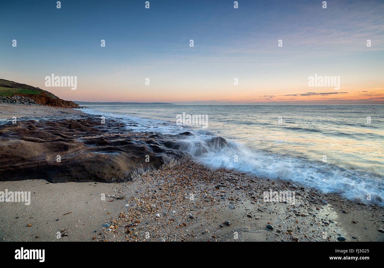 Sunrise over the beach at Hallsands in Devon and the ancient peat bed ...