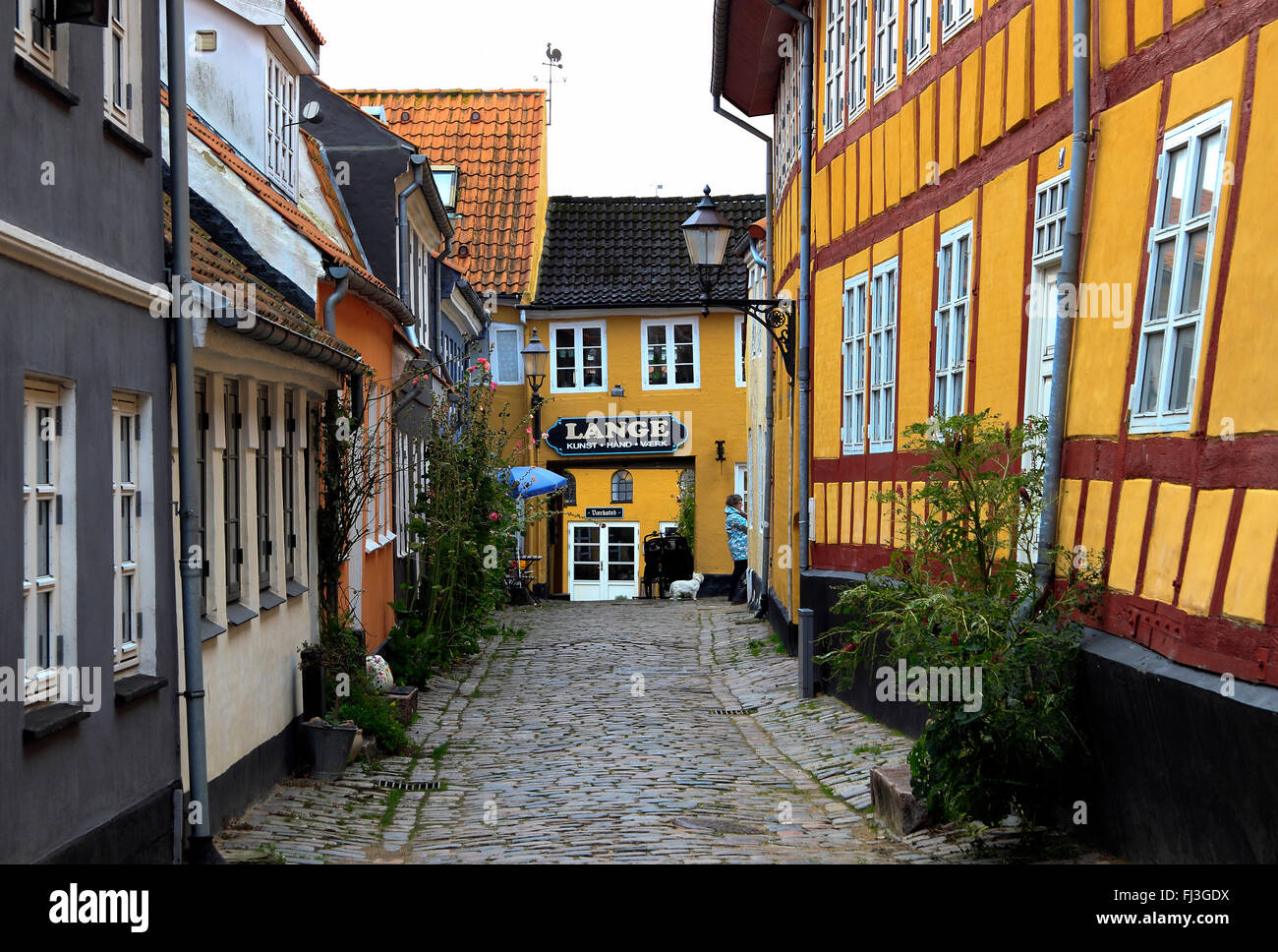 Narrow cobbled street, Aalborg Old Town, North Jutland, Denmark ...