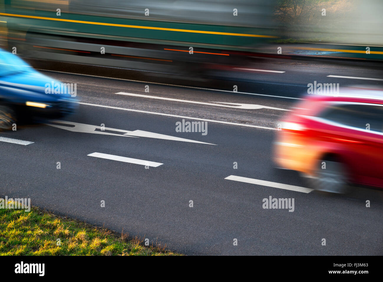 detail of speeding cars at a crossroad Stock Photo - Alamy