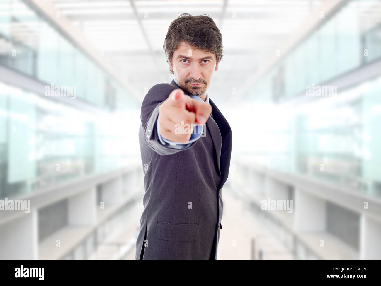 young business man pointing, at the office Stock Photo - Alamy