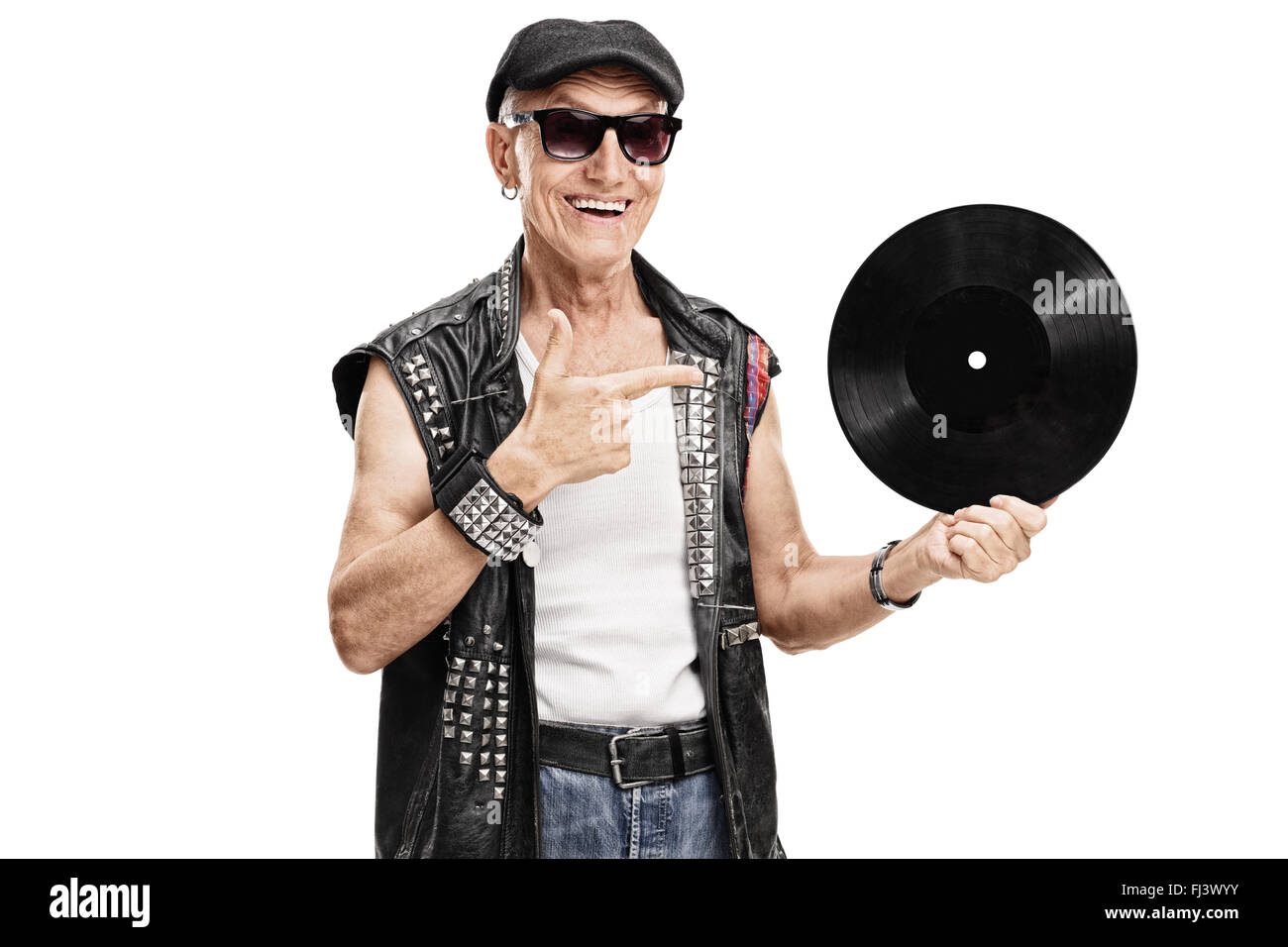 Senior punk rocker holding a vinyl and pointing to it with his finger ...