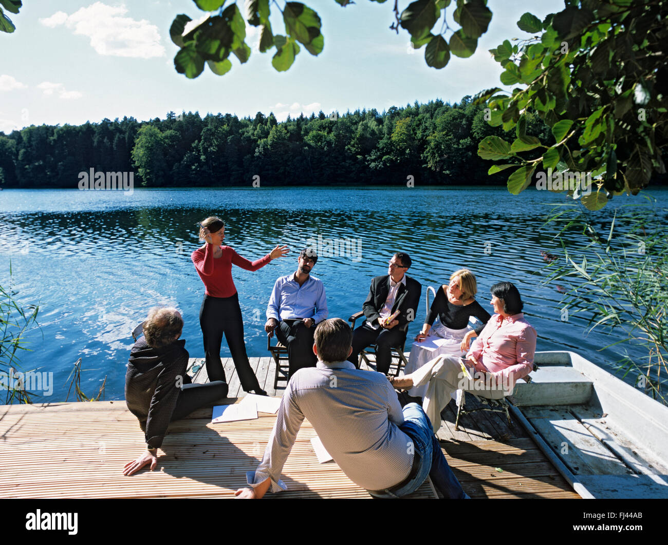 Germany, Business meeting at the lake Stock Photo - Alamy