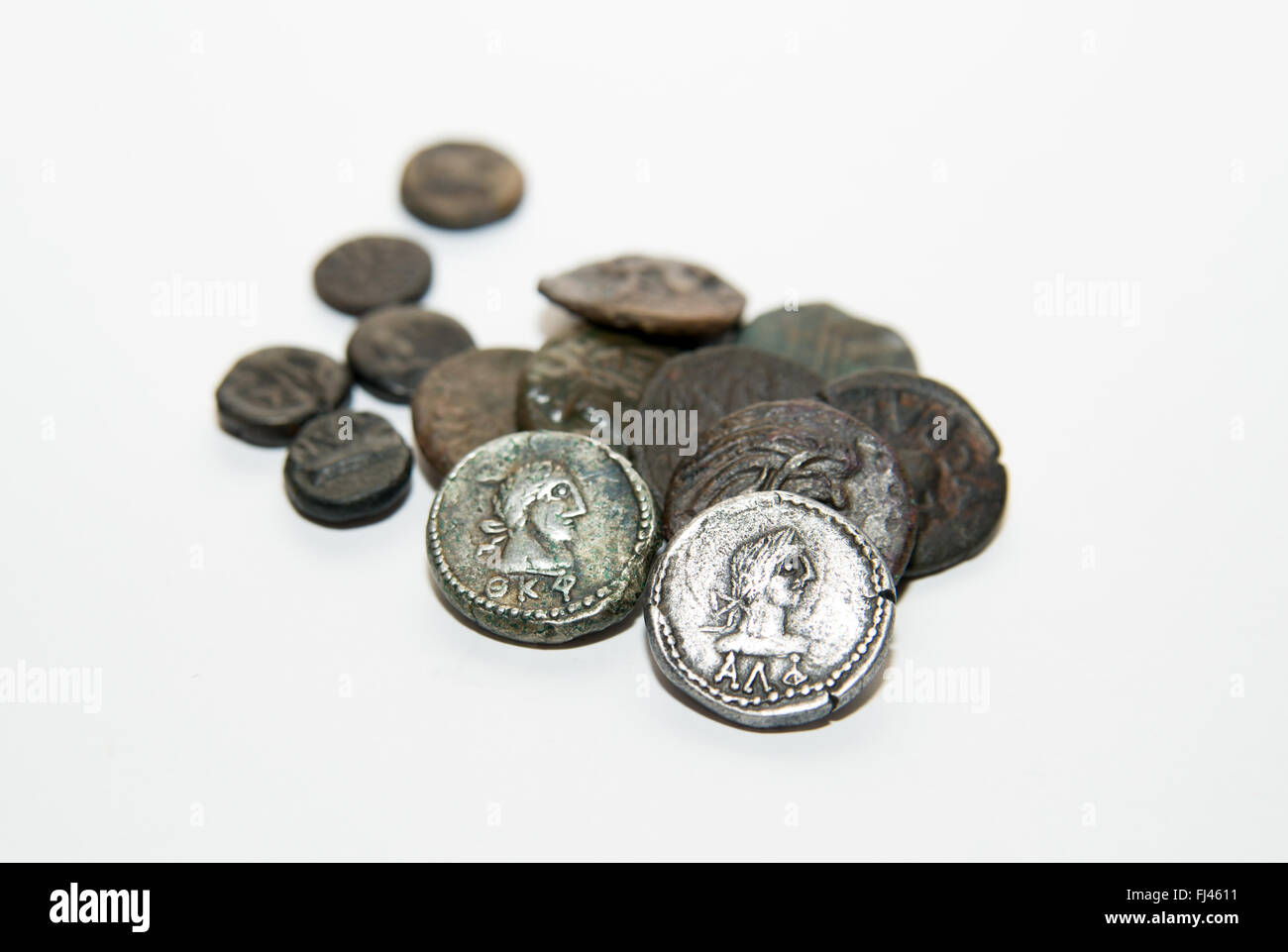 A lot of old coins with portraits of kings on a white background Stock ...