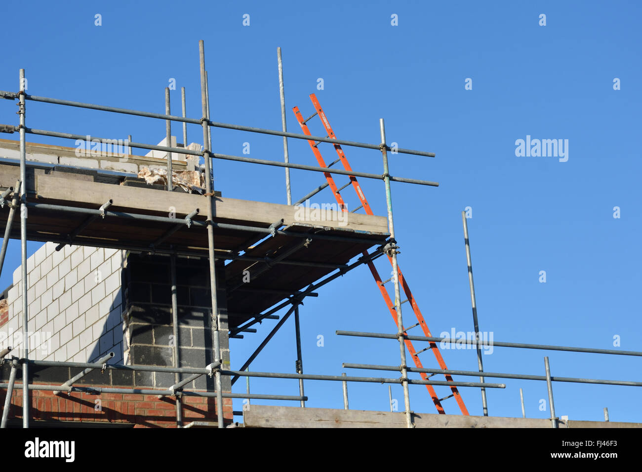 Construction site with ladder and scaffolding Stock Photo - Alamy