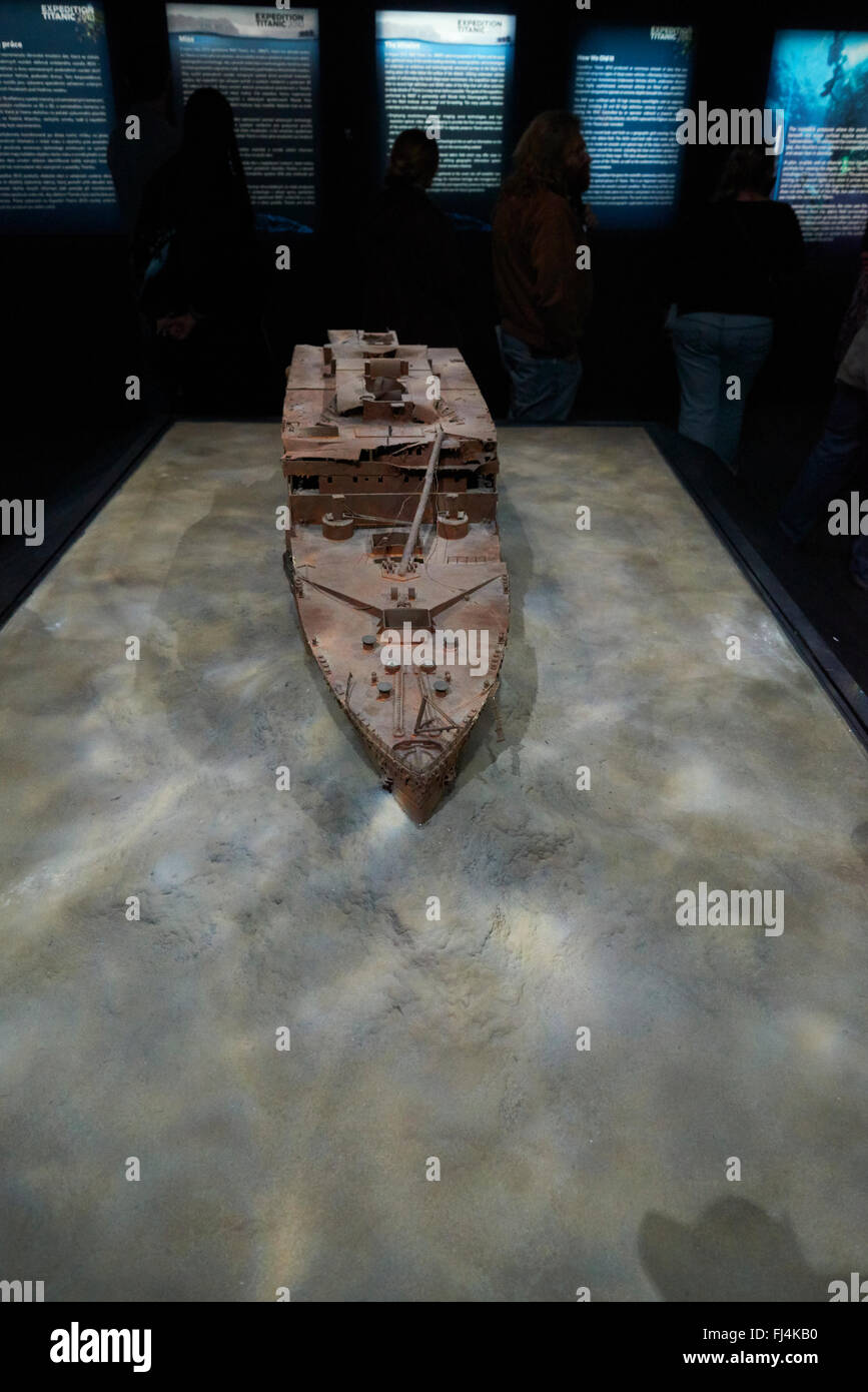 A visitor looks at authentic objects from the Titanic at the exhibition ...