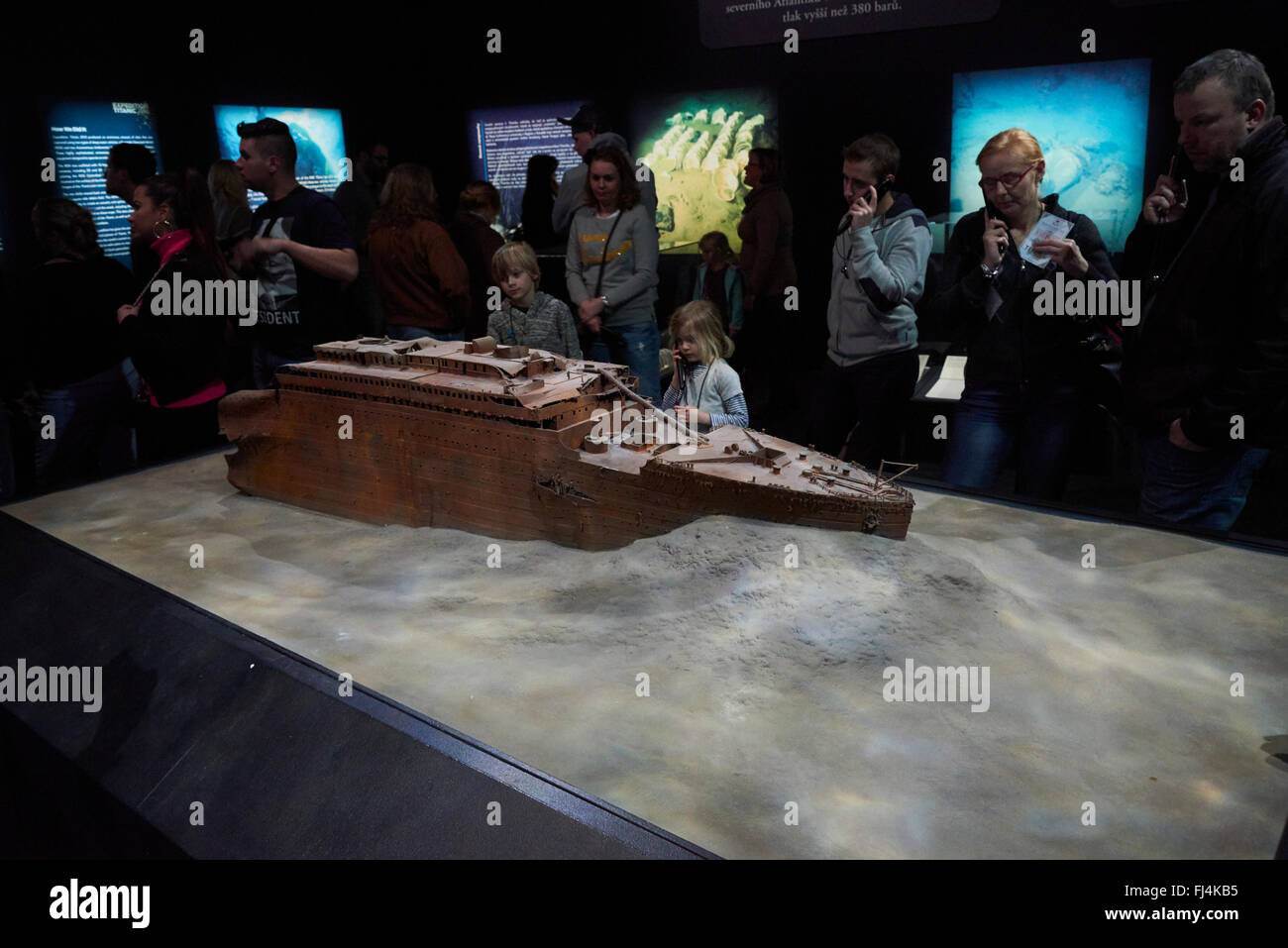 A visitor looks at authentic objects from the Titanic at the exhibition ...