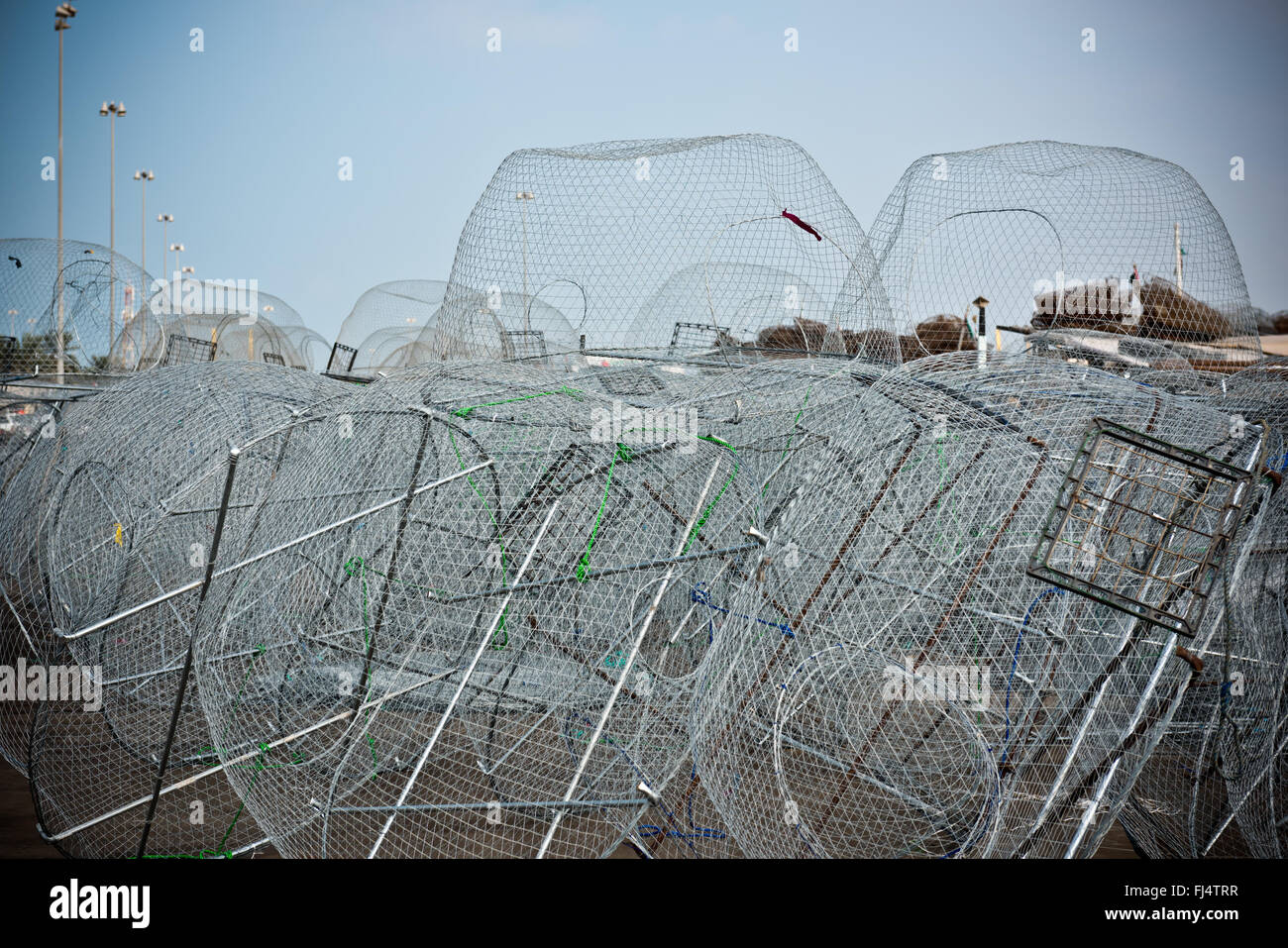 Metal fishing nets in a port. Horizontal shot Stock Photo - Alamy