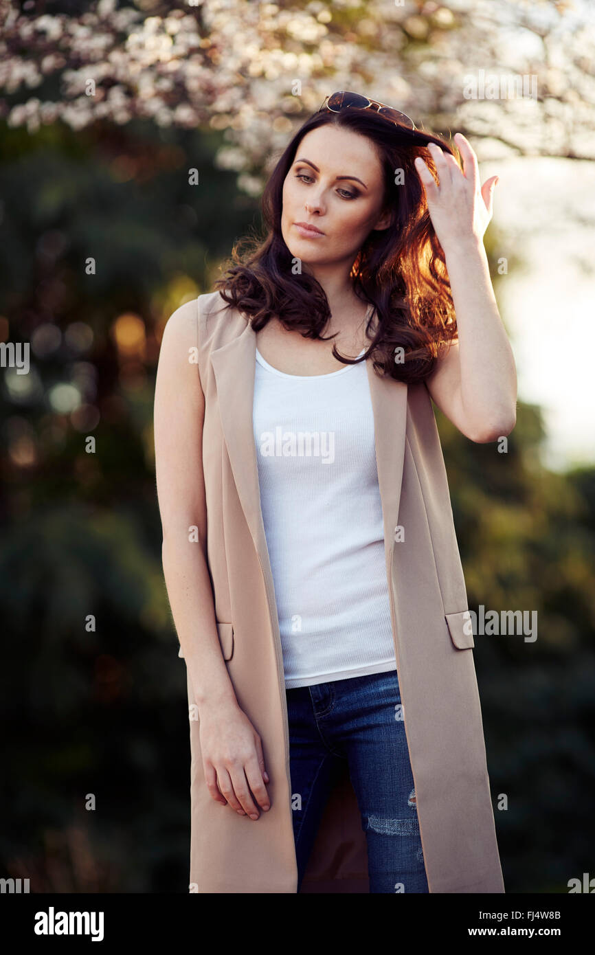 Woman walking outdoors Stock Photo - Alamy