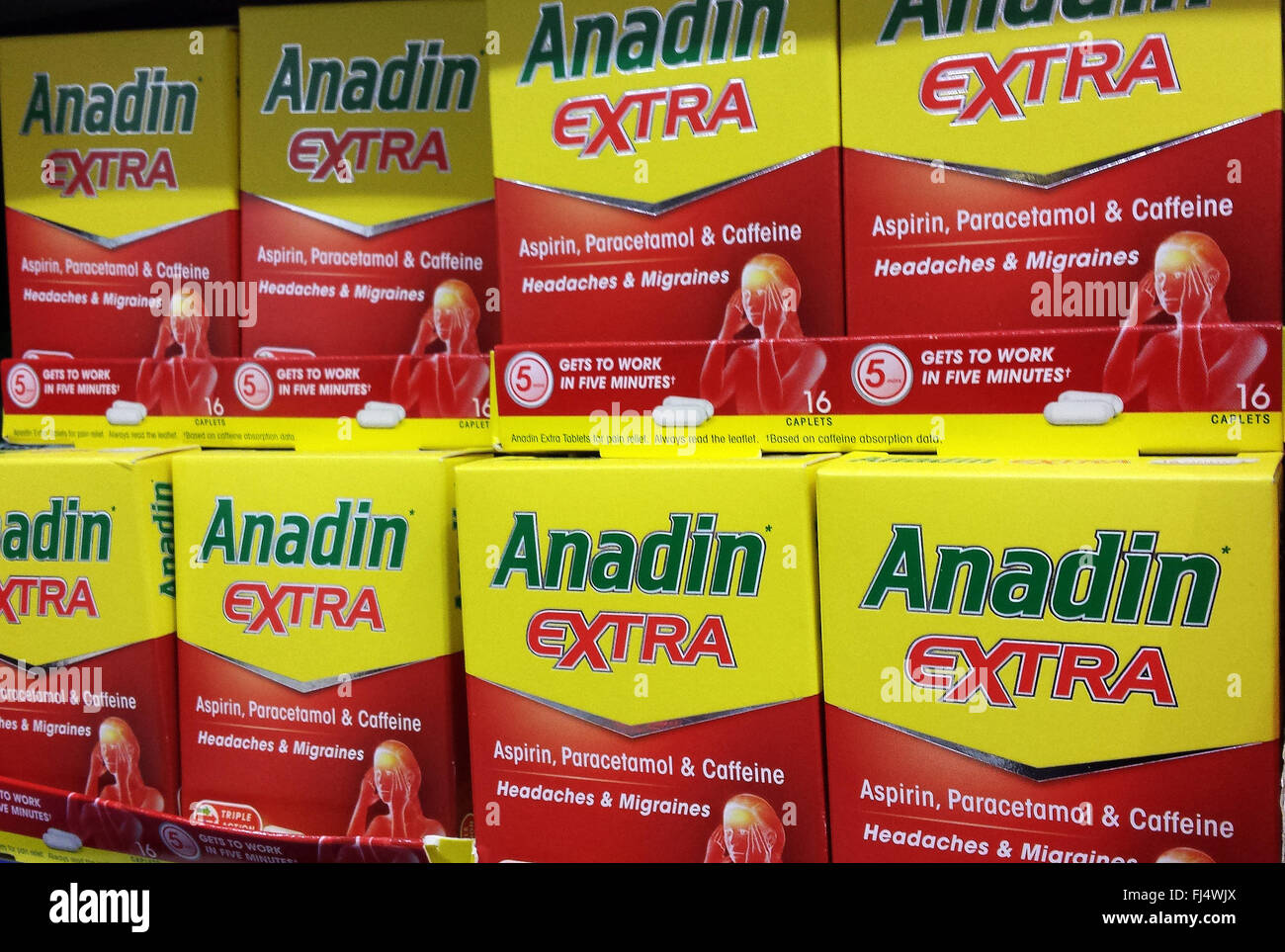 Packets of Anadin Extra headache tablets on a self Stock Photo - Alamy