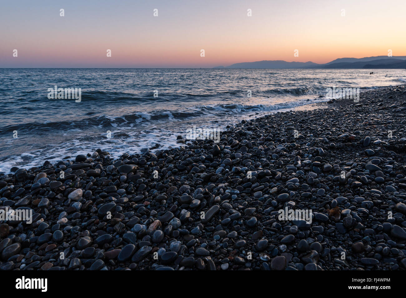 beautiful peach sunset on the sea coast Stock Photo - Alamy